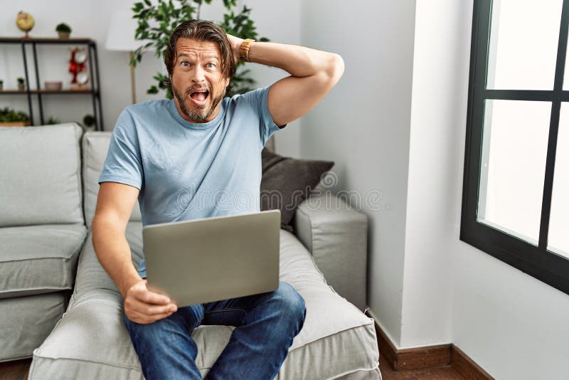 Handsome Middle Age Man Using Computer Laptop on the Sofa Crazy and ...