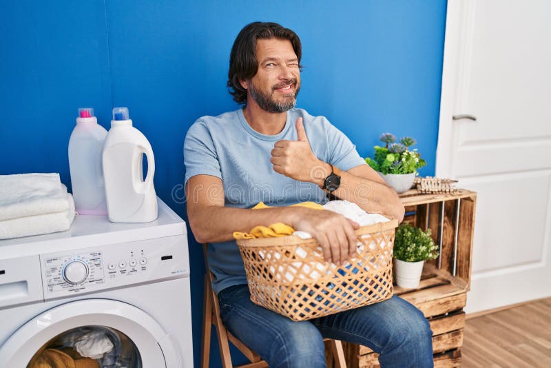 Handsome Middle Age Man Waiting for Laundry Doing Happy Thumbs Up ...