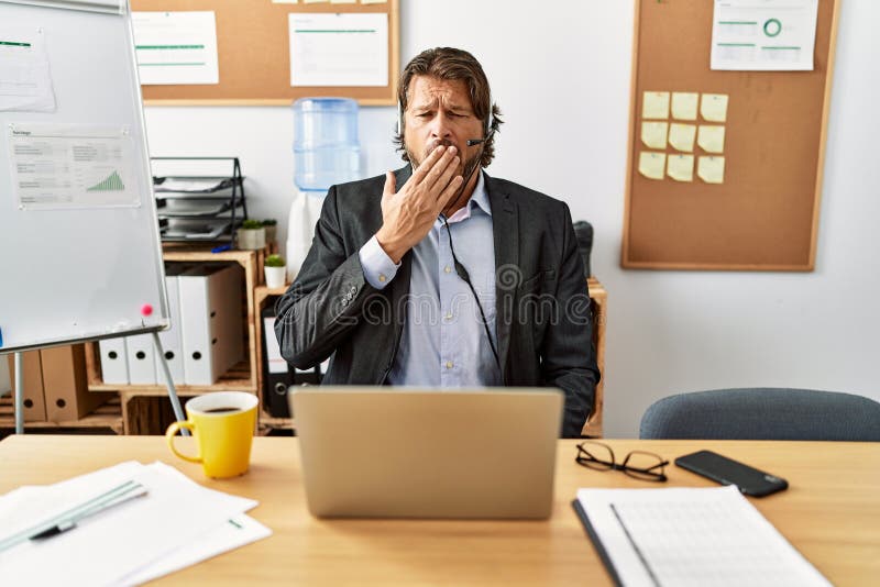 Handsome Middle Age Man Wearing Call Center Agent Headset At The Office