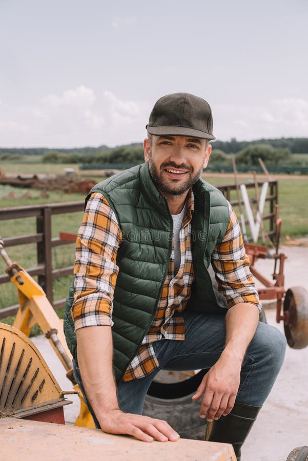 Handsome Middle Aged Farmer in Cap Smiling at Camera while Working ...