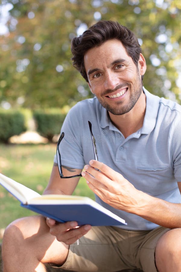 Handsome Middle Aged Man Reading Book Outdoors Stock Photo - Image of ...