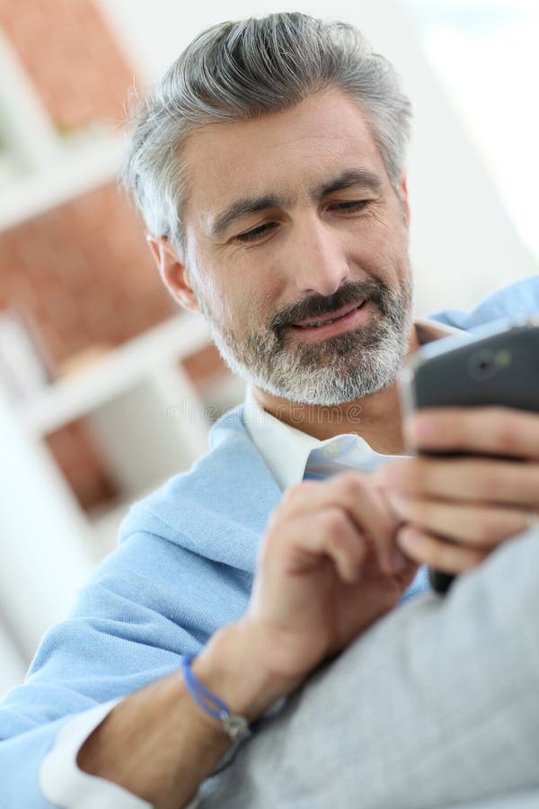 Handsome Middle-aged Man Using Smartphone Stock Photo - Image of ...