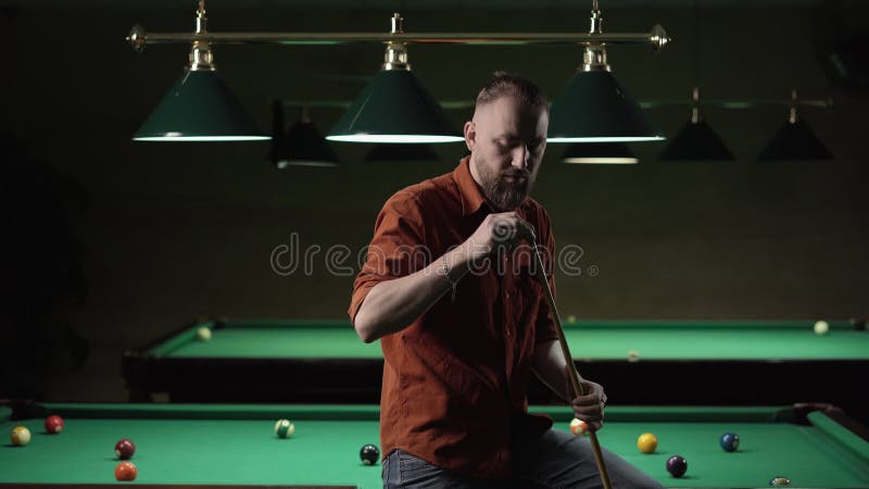 Handsome Millennial Serious Man Chalking Billiard Cue with Pool Table ...