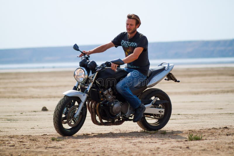 Handsome motorcycle rider stock image. Image of adventure - 91200453