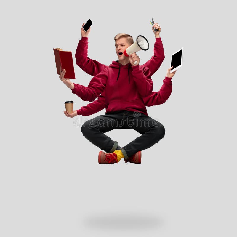Handsome Multi-armed Student Levitating on Grey Studio Background with ...
