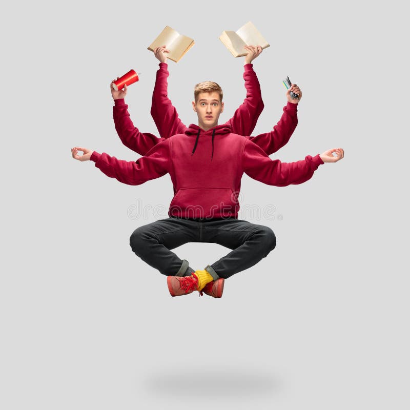 Handsome Multi-armed Student Levitating on Grey Studio Background with ...