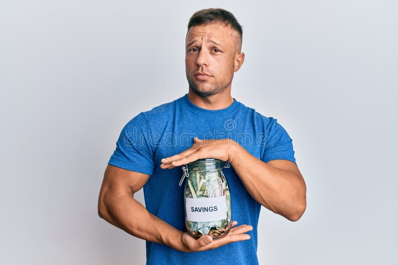 Handsome Muscle Man Holding Jar with Savings Clueless and Confused ...