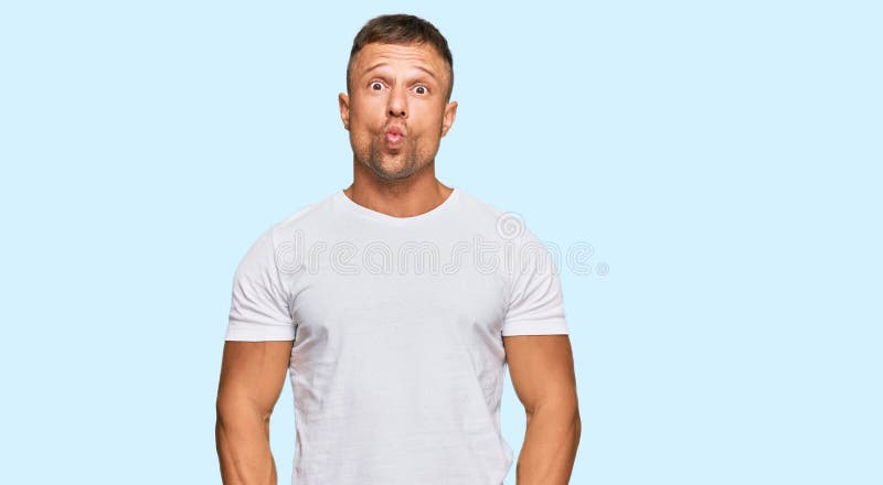 Handsome Muscle Man Wearing Casual White Tshirt Making Fish Face with ...