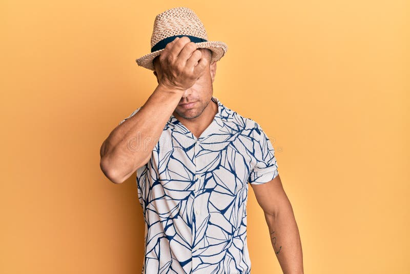 Handsome Muscle Man Wearing Summer Hat Surprised with Hand on Head for ...