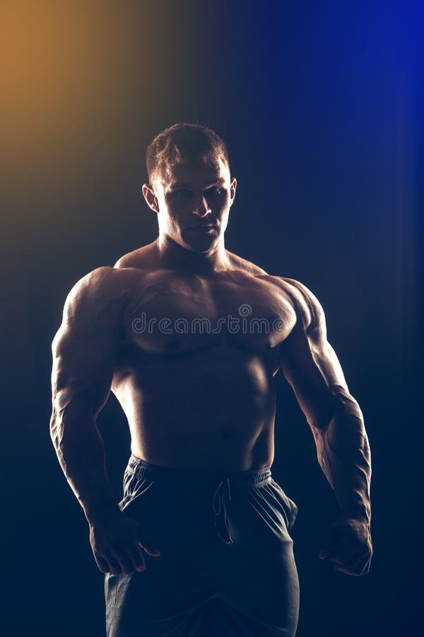 .bodybuilder Posing. Beautiful Sporty Guy Male Power. Fitness Muscled ...