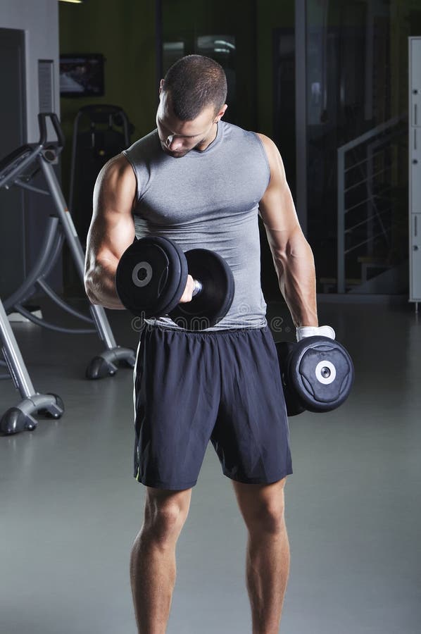 Handsome Muscular Male Model Doing Biceps Exercise Stock Photo - Image ...