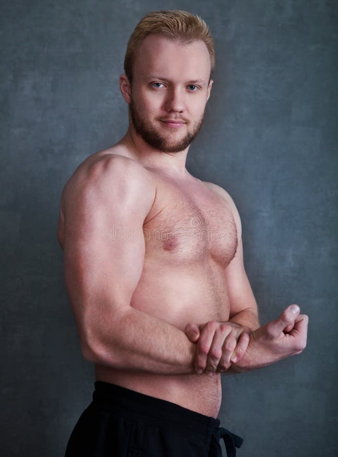 Handsome Muscular Male Model Near the Wall Stock Photo - Image of dark ...