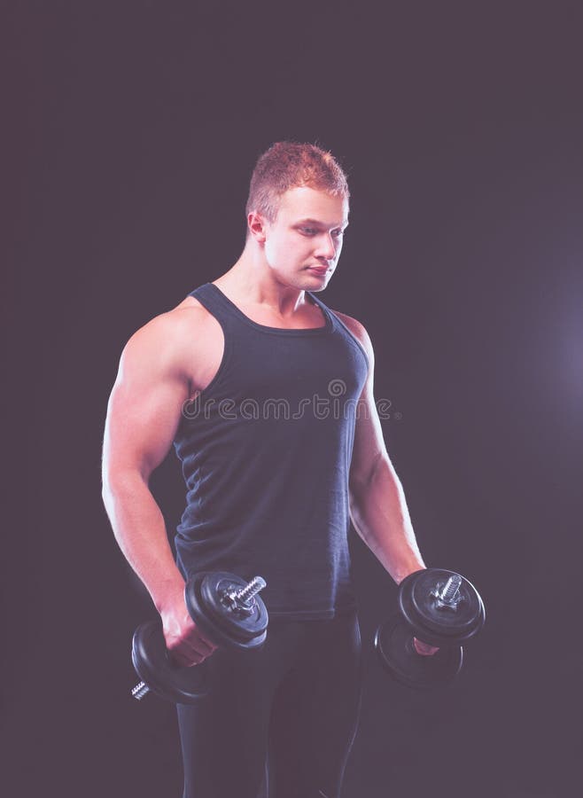 Handsome Muscular Man Working Out with Dumbbells Stock Image - Image of ...