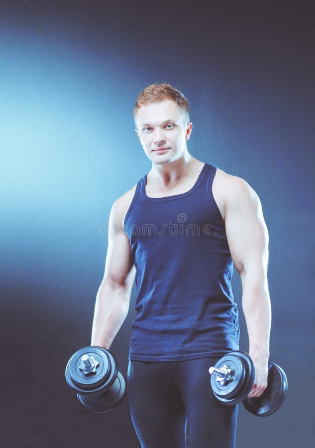 Handsome Muscular Man Working Out with Dumbbells Stock Photo - Image of ...