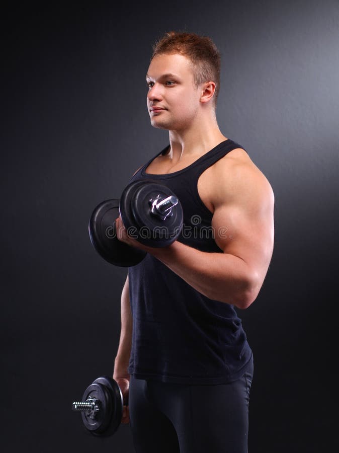 Handsome Muscular Man Working Out with Dumbbells Stock Photo - Image of ...