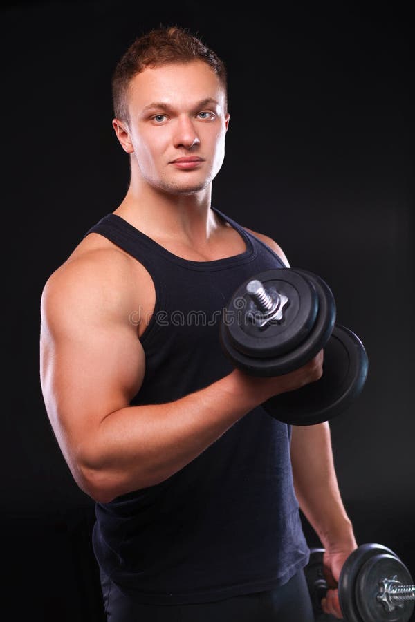 Handsome Muscular Man Working Out with Dumbbells Stock Image - Image of ...