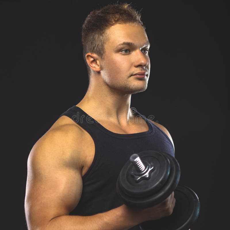 Handsome Muscular Man Working Out with Dumbbells Stock Image - Image of ...