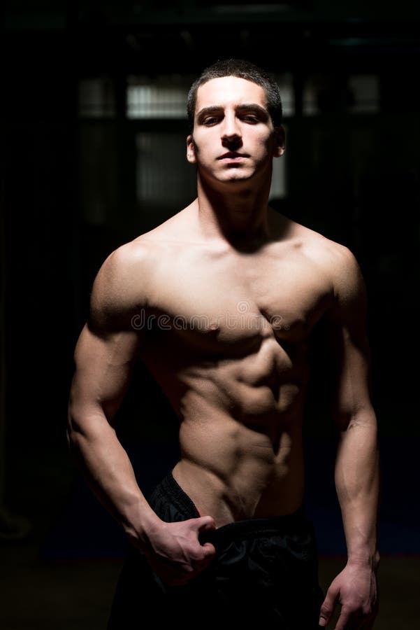 Handsome Muscular Men Flexing Muscles Stock Photo - Image of bicep ...