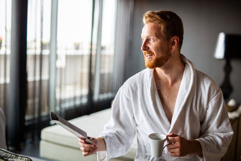 Handsome, Muscular, Young Man Drinking His Morning Coffee in a Hotel ... Handsome, Muscular, Young Man Drinking His Morning Coffee in a Hotel ...