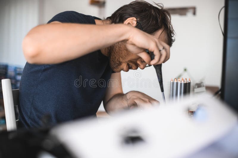 Handsome Nerd Man is Servicing Computer Motherboard and Cooler. Stock ...