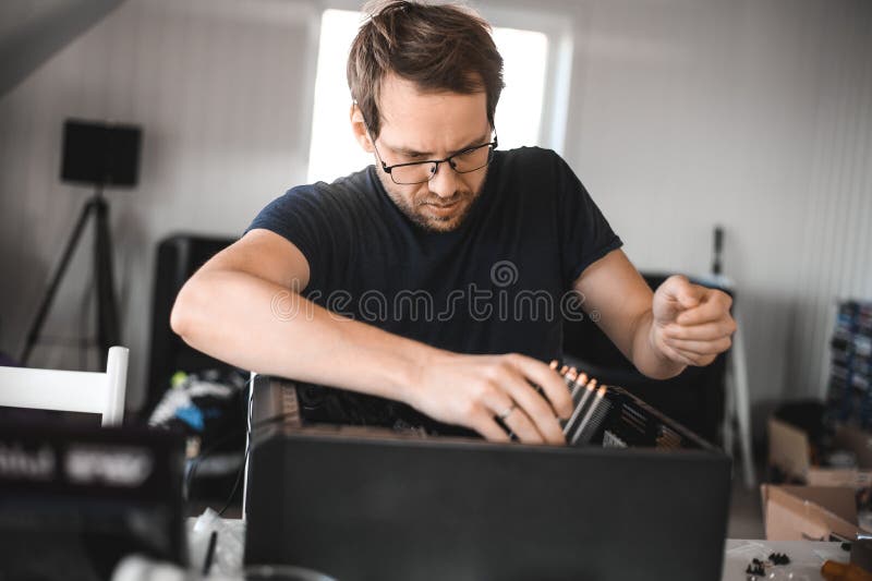 Handsome Nerd Man is Servicing Computer Motherboard and Cooler. Stock ...