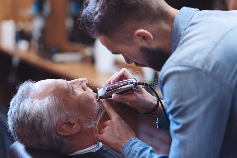 Handsome Barber Trimming Hair of Old Man Stock Photo - Image of ...
