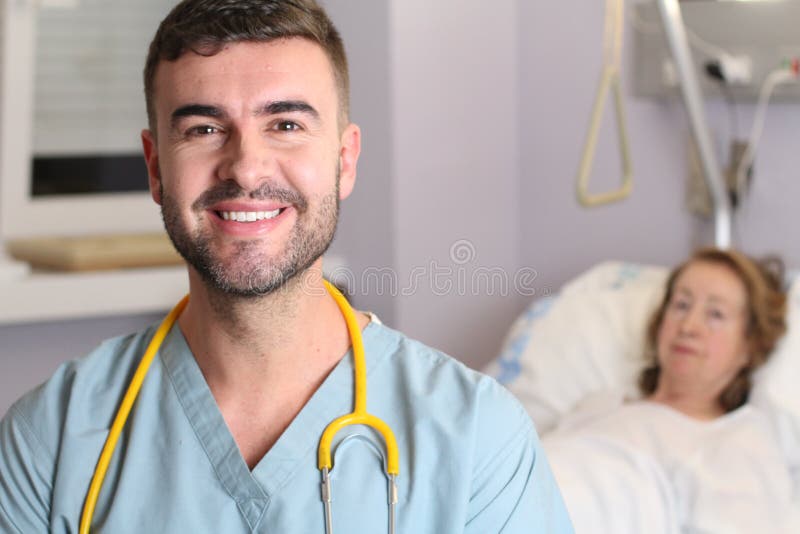 Handsome Nurse in Hospital Room with Patient Stock Photo - Image of ...