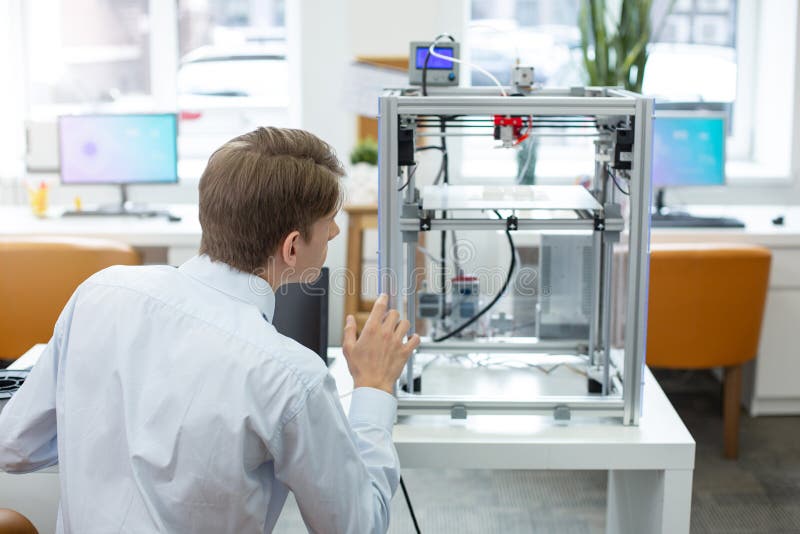 Handsome Office Worker Looking at 3D Printer Stock Photo - Image of ...