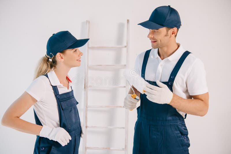 Handsome Painter in Uniform Holding Paint Stock Photo - Image of ...