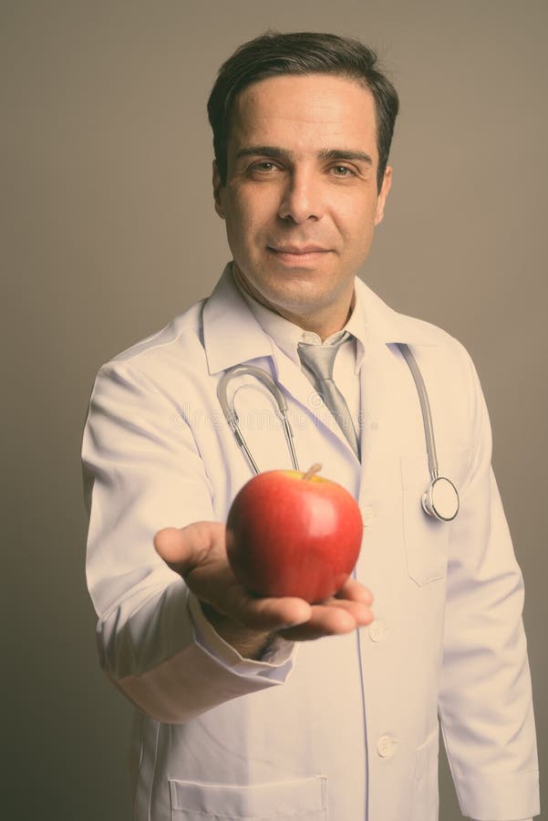 Handsome Persian Man Doctor Against Gray Background Stock Photo - Image ...