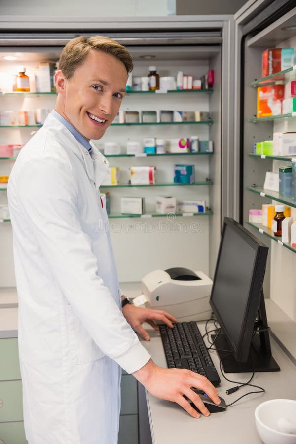 Handsome Pharmacist Using the Computer Stock Image - Image of ...