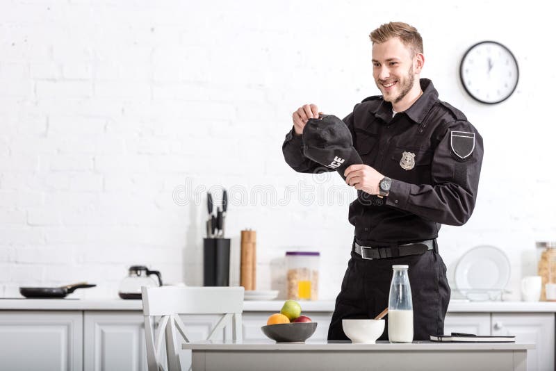 Handsome Police Officer with Cap in Hands Smiling Stock Image - Image ...
