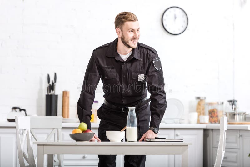 Handsome Police Officer Standing Next To Table Stock Photo - Image of ...
