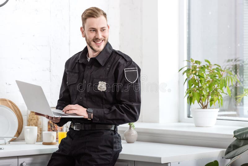 Handsome Policeman Smiling and Using Laptop Stock Image - Image of ...