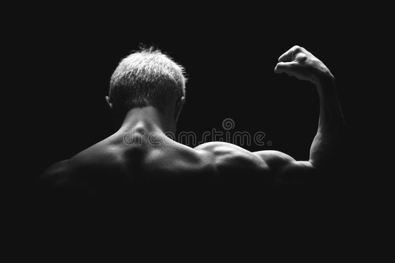 Handsome Power Athletic Man in Dramatic Light. Strong Bodybuilder with ...