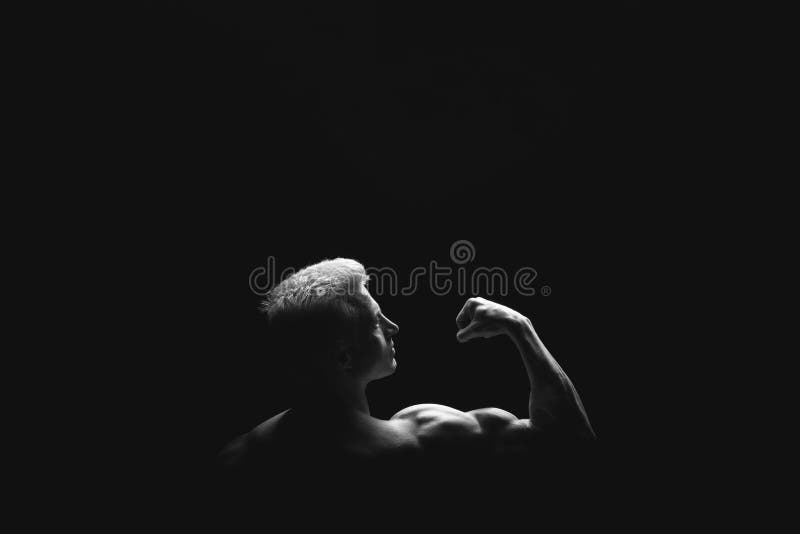 Handsome Power Athletic Man in Dramatic Light. Strong Bodybuilder with ...