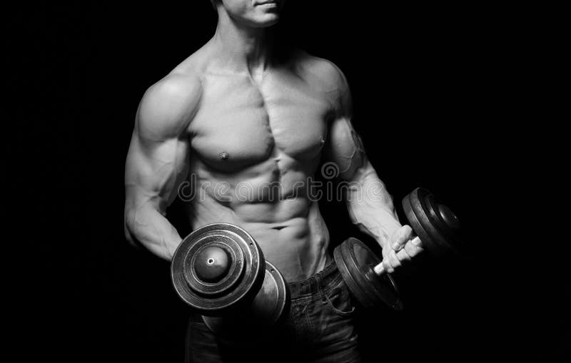 Handsome Power Athletic Man with Dumbbell Confidently Looking Forward ...