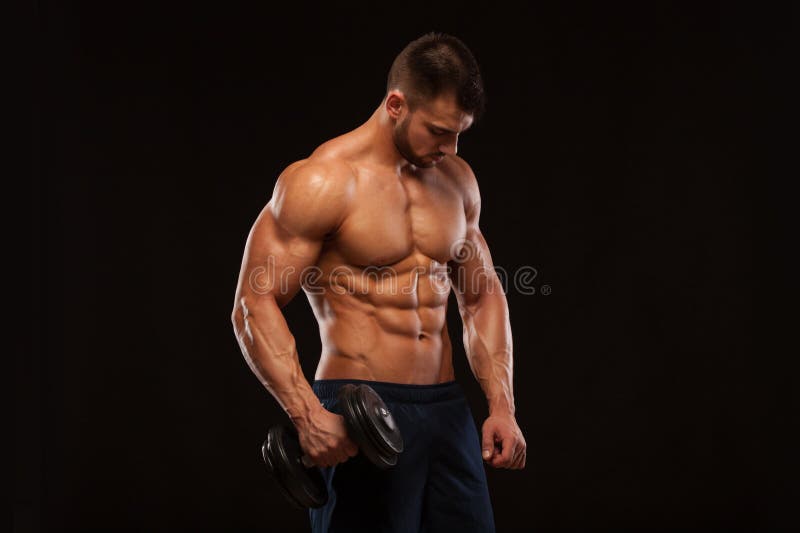 Handsome Power Athletic Man with Dumbbell is Confidently Looking ...