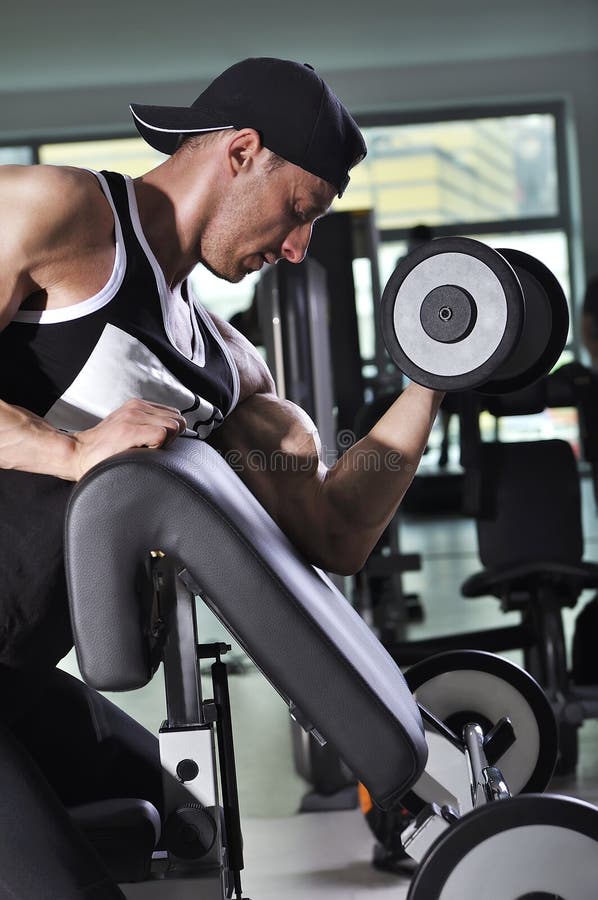 Handsome Powerful Athletic Man Doing Biceps Exercise with Dumbbell ...