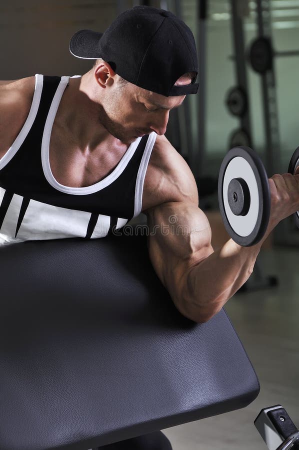 Handsome Powerful Athletic Man Doing Biceps Exercise with Dumbbell ...