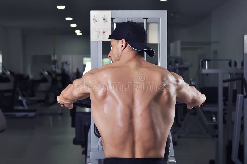 Handsome Powerful Athletic Man Performing Back Exercise. Stock Photo ...