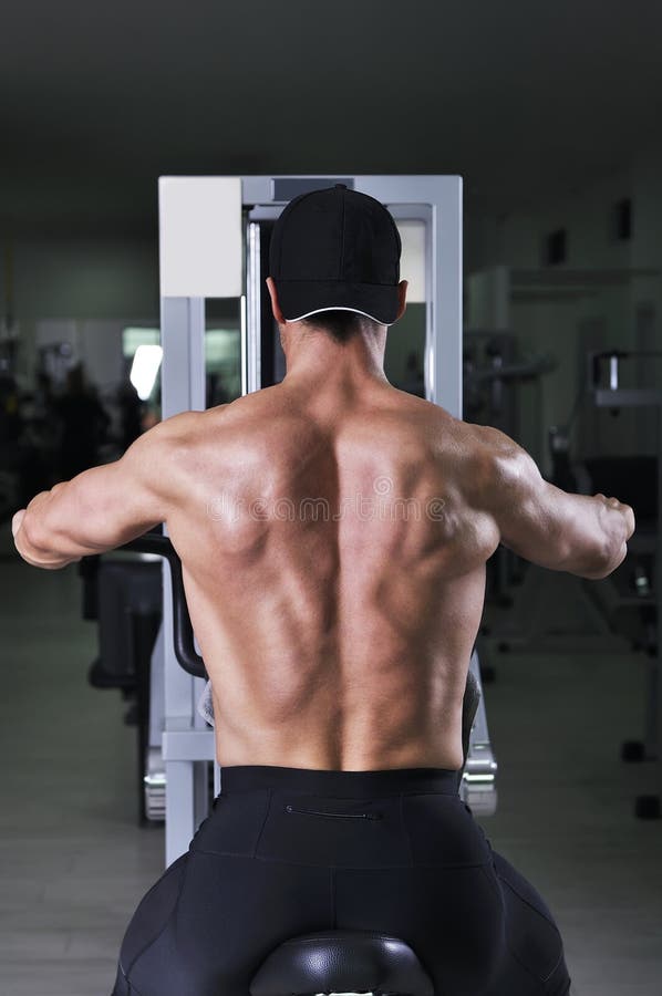Handsome Powerful Athletic Man Performing Back Exercise. Stock Image ...