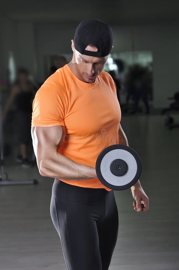 Handsome Powerful Athletic Man Performing Biceps Exercise with Dumbbell ...