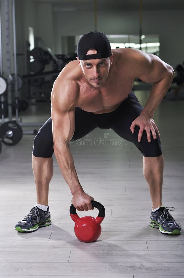Handsome Powerful Athletic Man Performing Kettle Bell Exercise. Stock ...