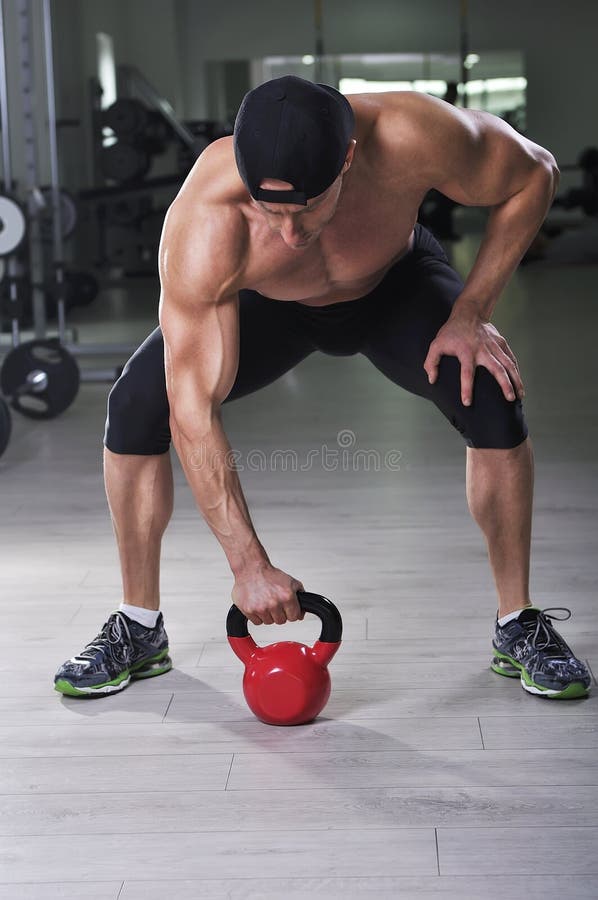 Handsome Powerful Athletic Man Performing Kettle Bell Exercise. Stock ...