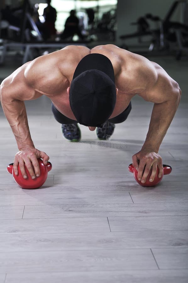 Handsome Powerful Athletic Man Performing Push Ups with Kettle Bell ...