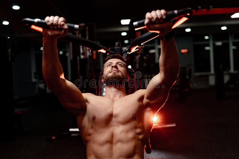 Handsome Powerful Man Doing Bench Press. Fit Bodybuilder Working Hard ...
