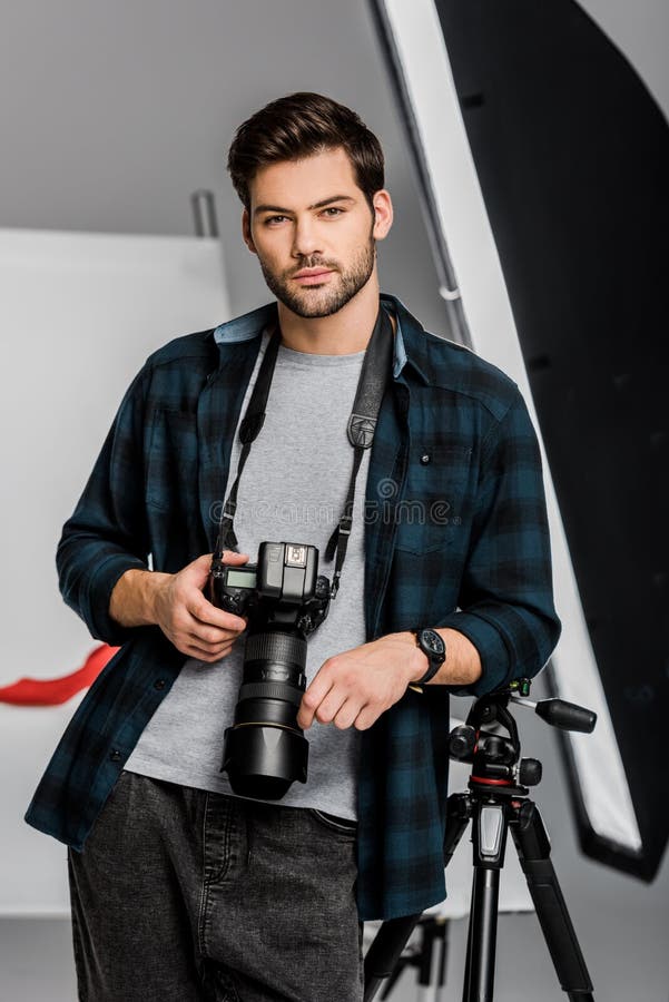 Handsome Professional Young Photographer Looking at Camera Stock Image ...