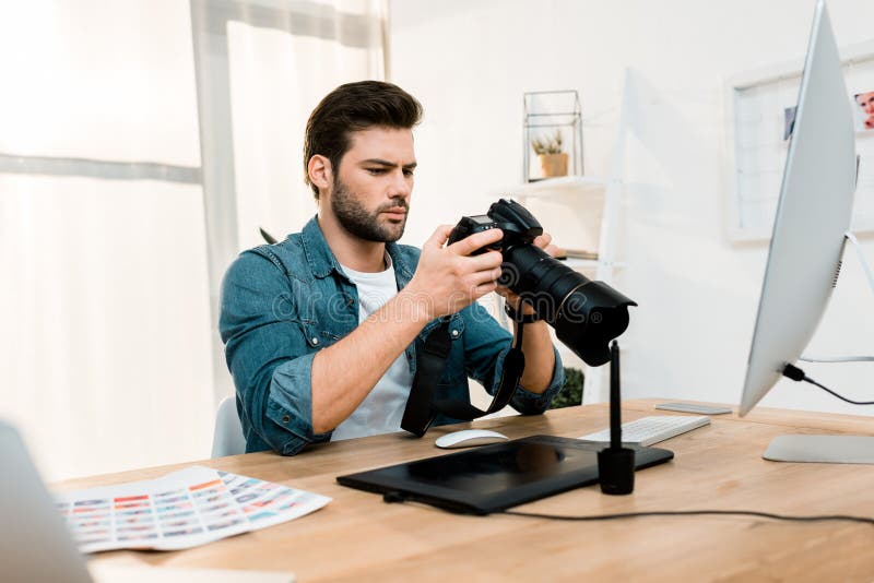Handsome Professional Young Photographer Using Camera Stock Photo ...