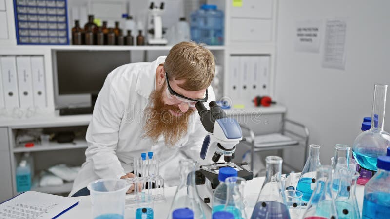 Handsome Redhead Scientist Man, Immersed in Research, Meticulously ...